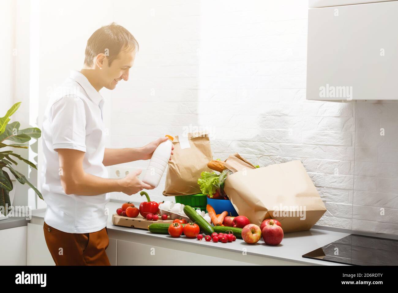 Happy male customer open cardboard box receive postal mail delivery ...