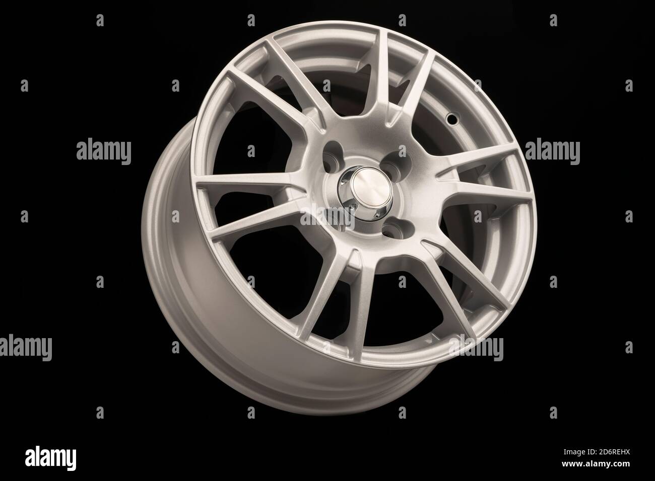 New silver alloy wheel on black background, side view Stock Photo - Alamy