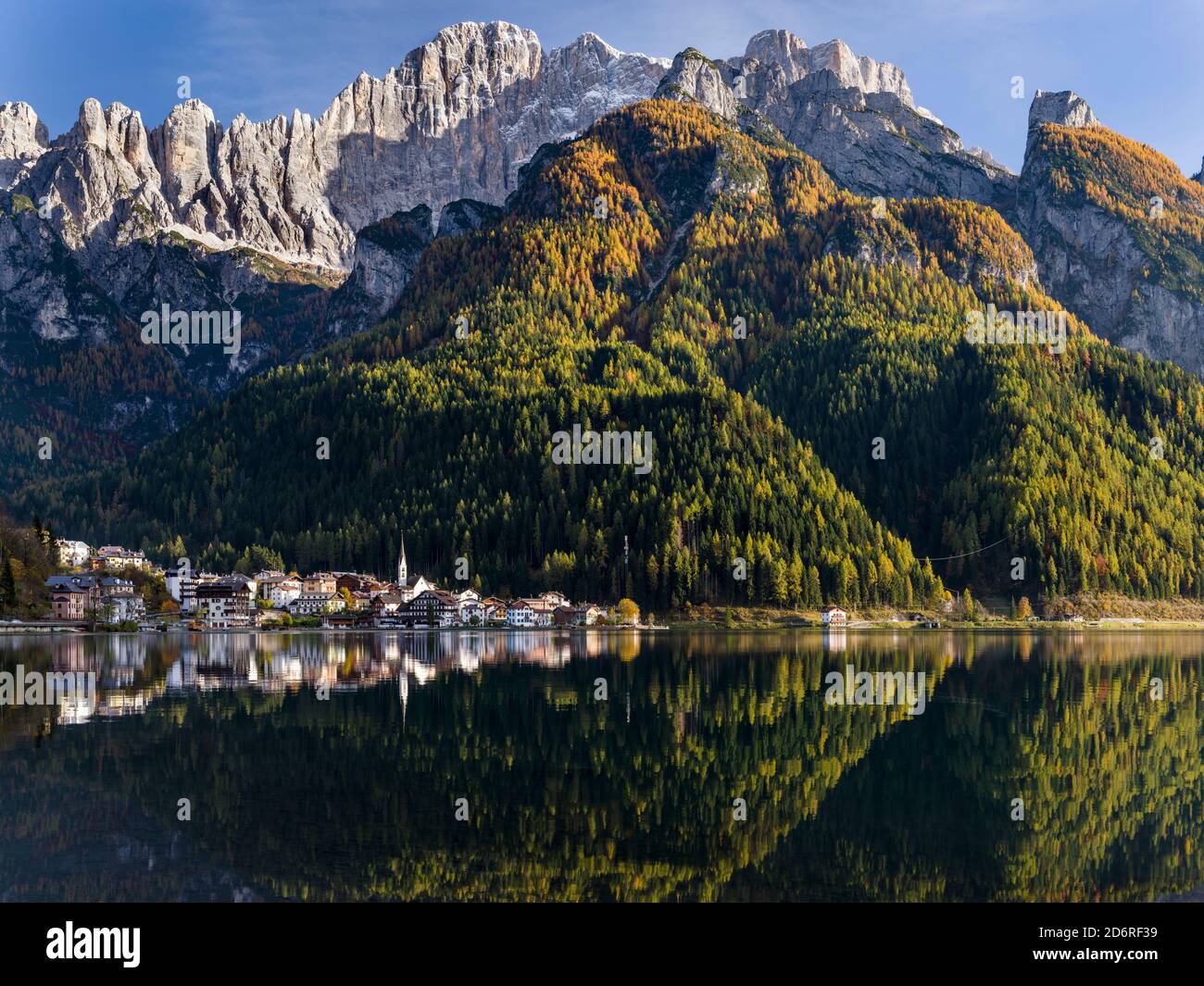 Village Alleghe at Lago di Alleghe at the foot of mount Civetta, one of ...