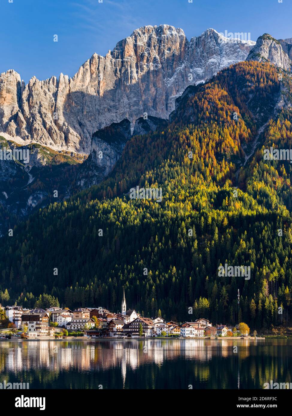 Village Alleghe at Lago di Alleghe at the foot of mount Civetta, one of ...