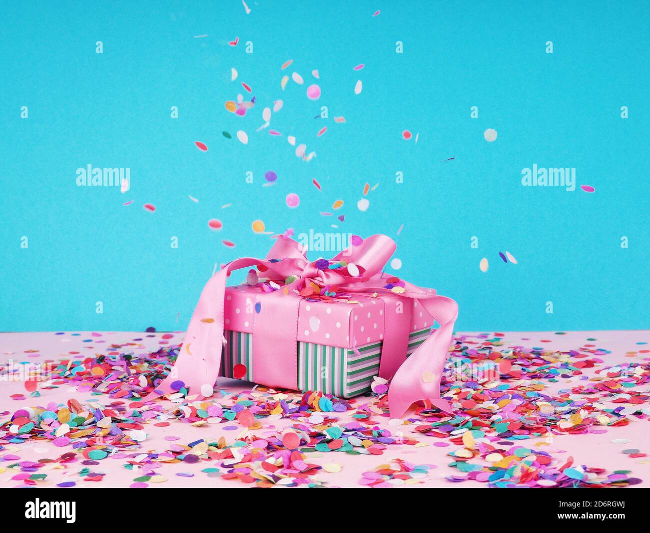 Gift boxes with paper confetti. gift box on pink background around ...