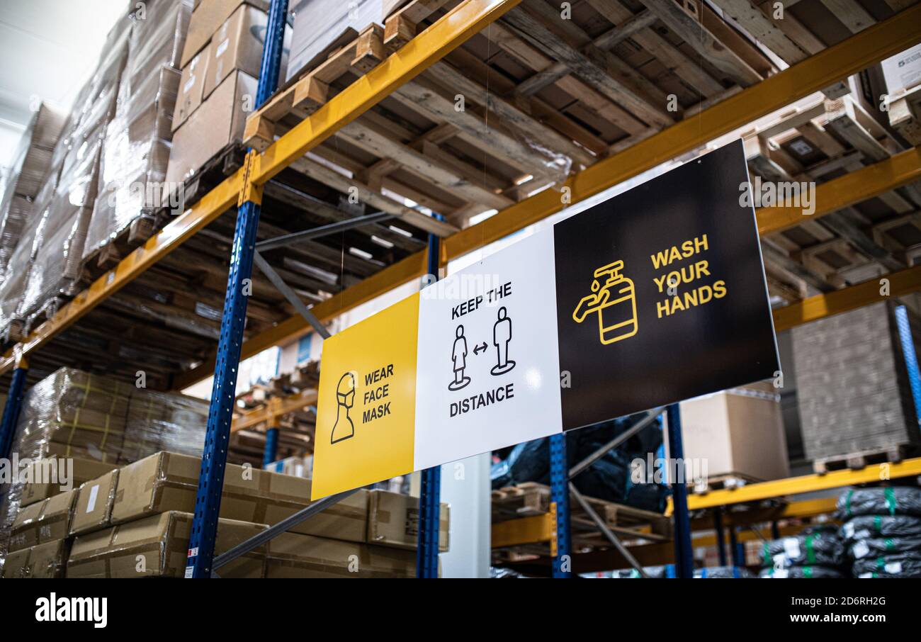 Safety signs on shelves indoors in warehouse, coronavirus concept Stock ...