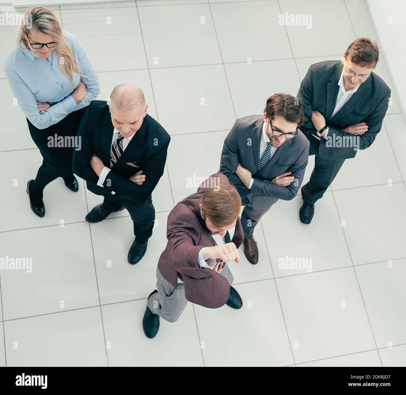 top view. leader and a group of employees standing together Stock Photo ...