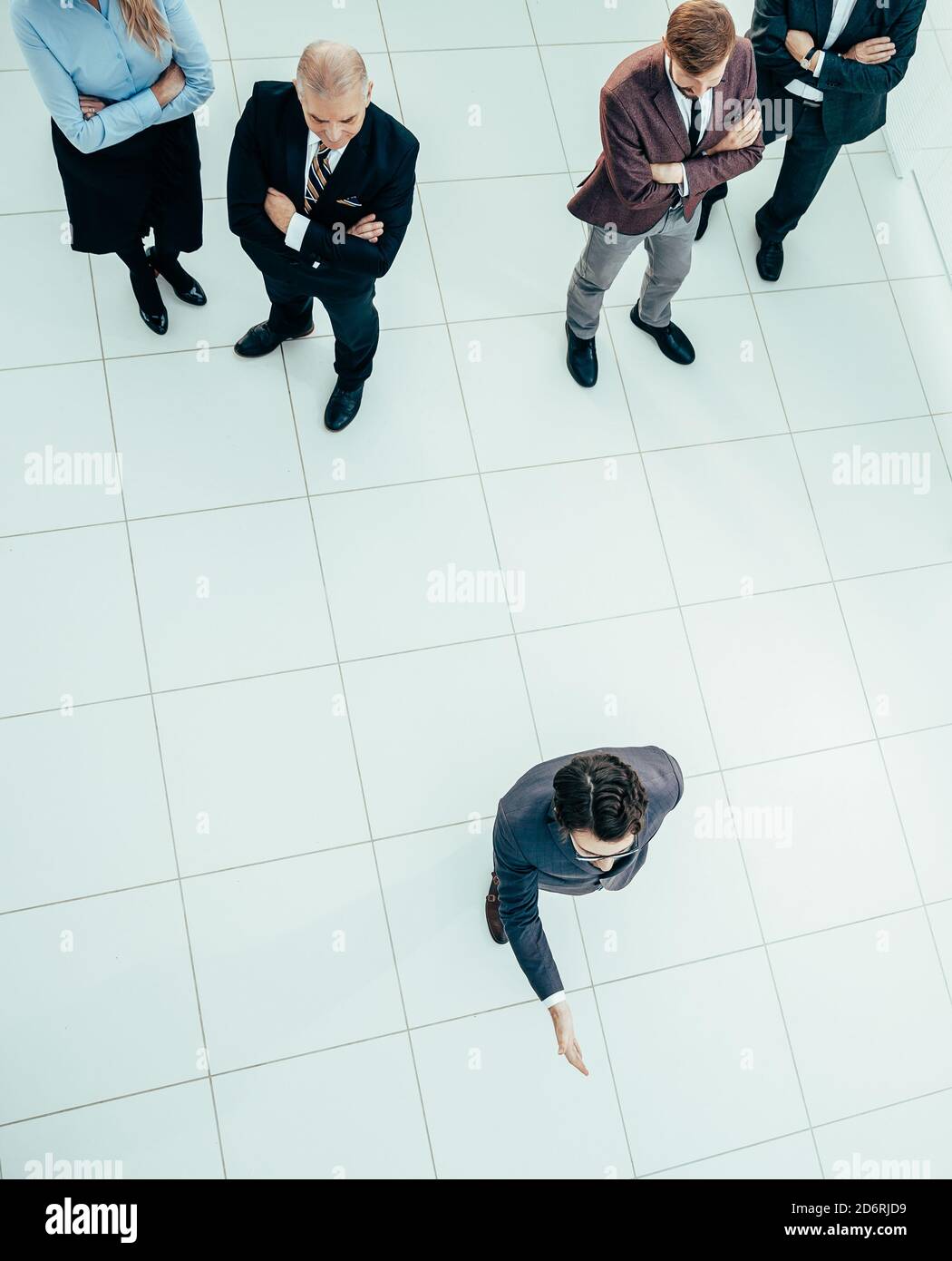 top view. leader standing in front of a group of employees Stock Photo ...