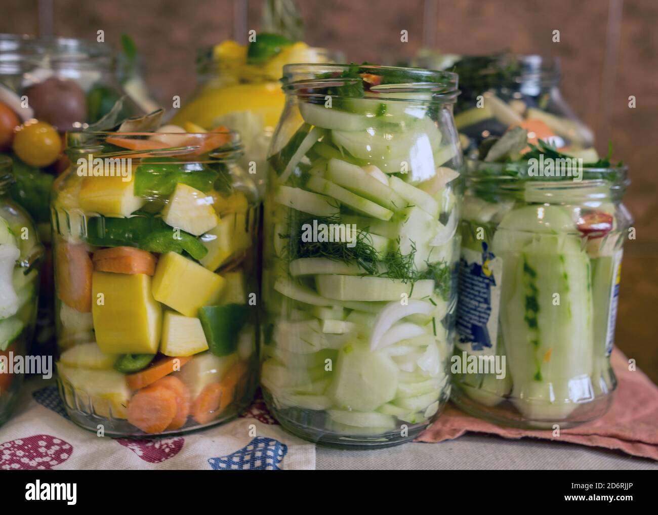 glass jars with various vegetables, canned vegetables, salting various ...