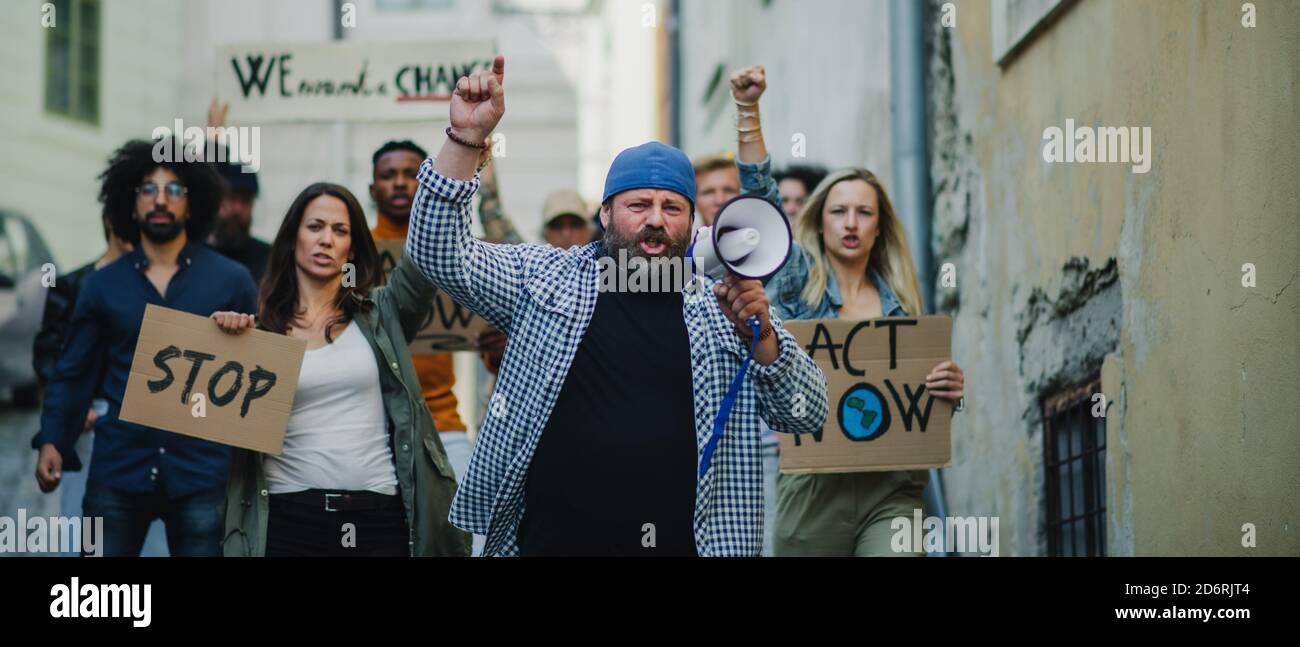 Group of people activists protesting on streets, strike and ...