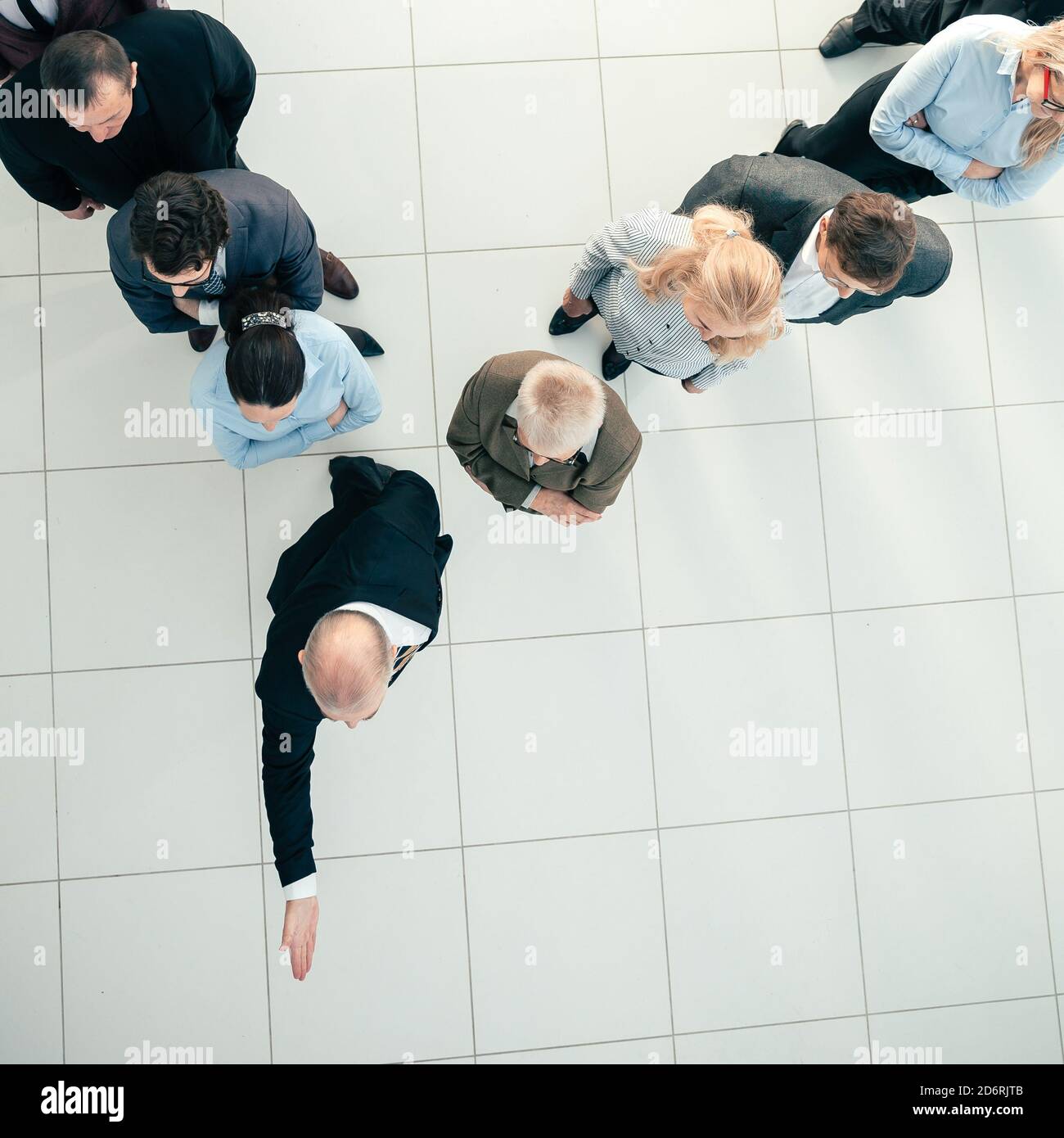 top view. a confident businessman leading his team forward Stock Photo ...