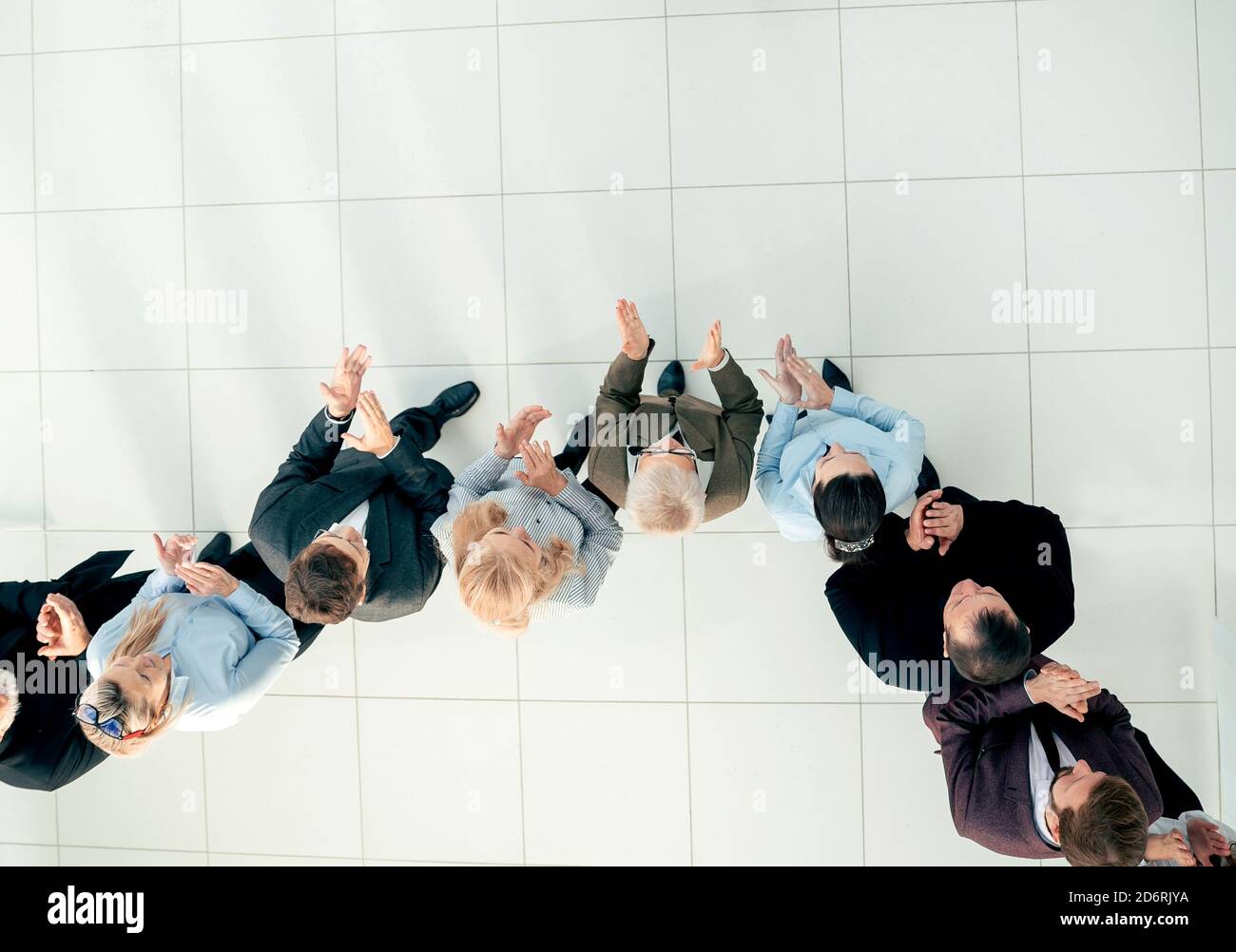 top view. business partners standing in front of a large group of ...