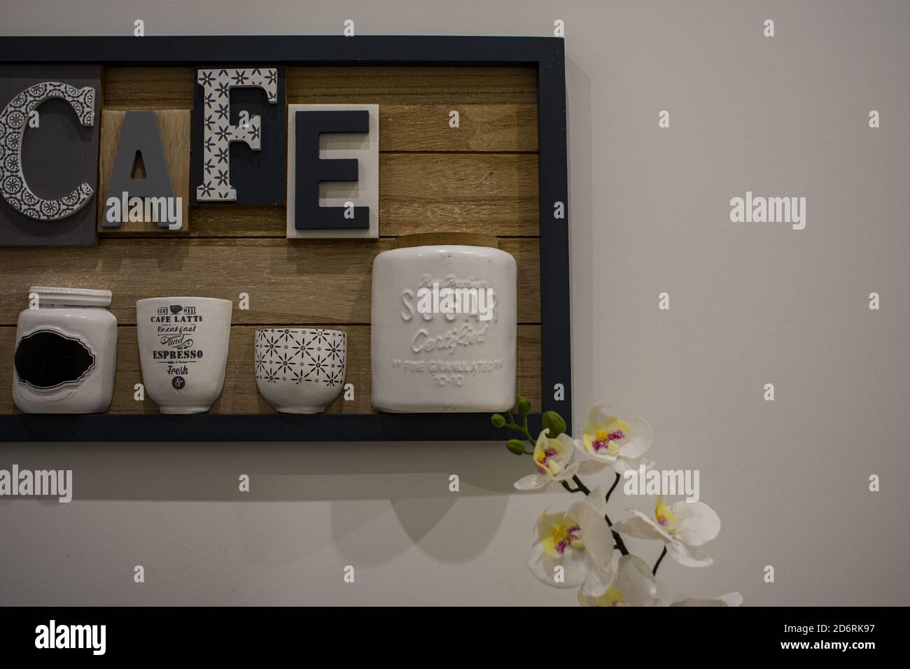 Decorative framed board with the word ''CAFE'' with differently ...