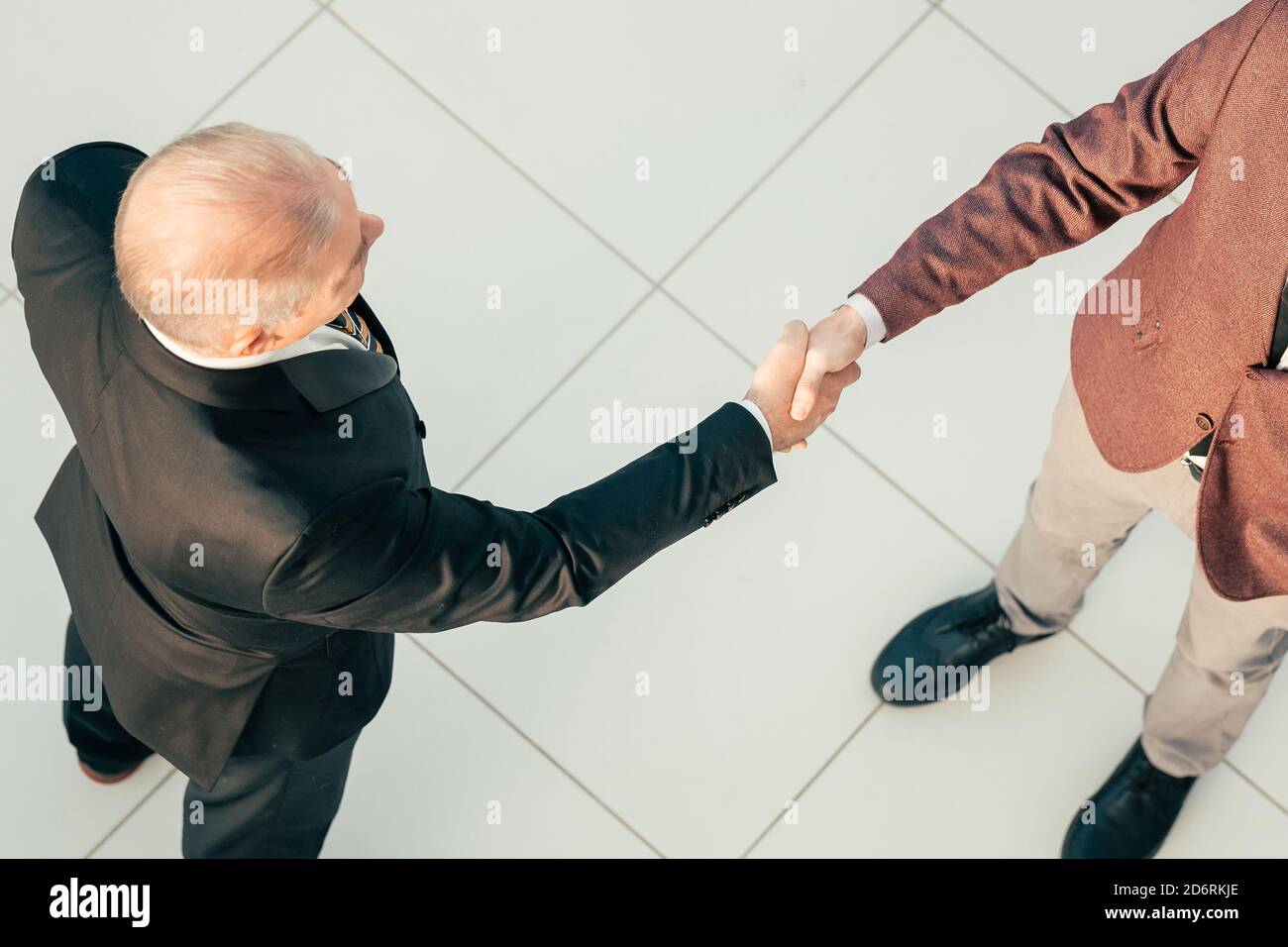 top view. businessman shaking hands with his business partner Stock ...