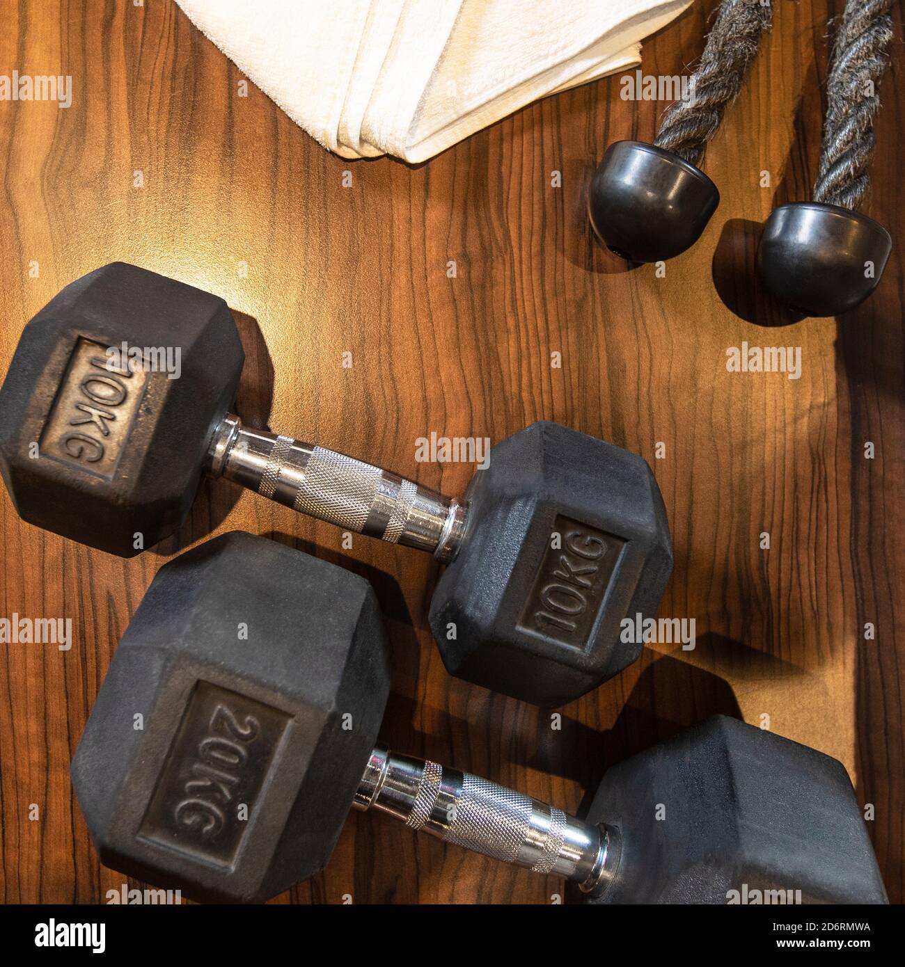 Dumbbell barbell towel top view, gym concept Stock Photo - Alamy
