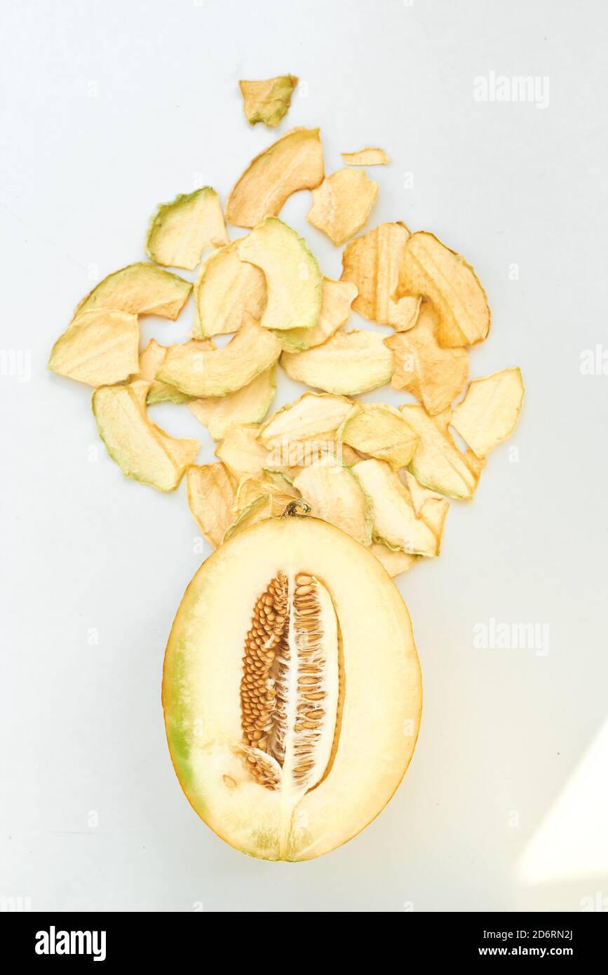 Fruit chips with melon on white background. Top view Stock Photo - Alamy