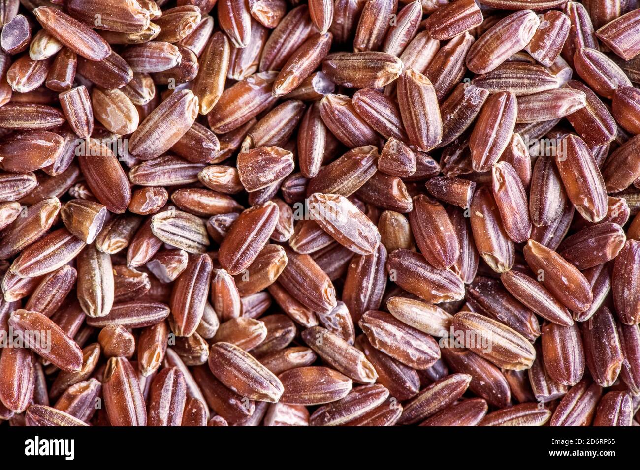 Rice background, red rice close-up, top view Stock Photo - Alamy