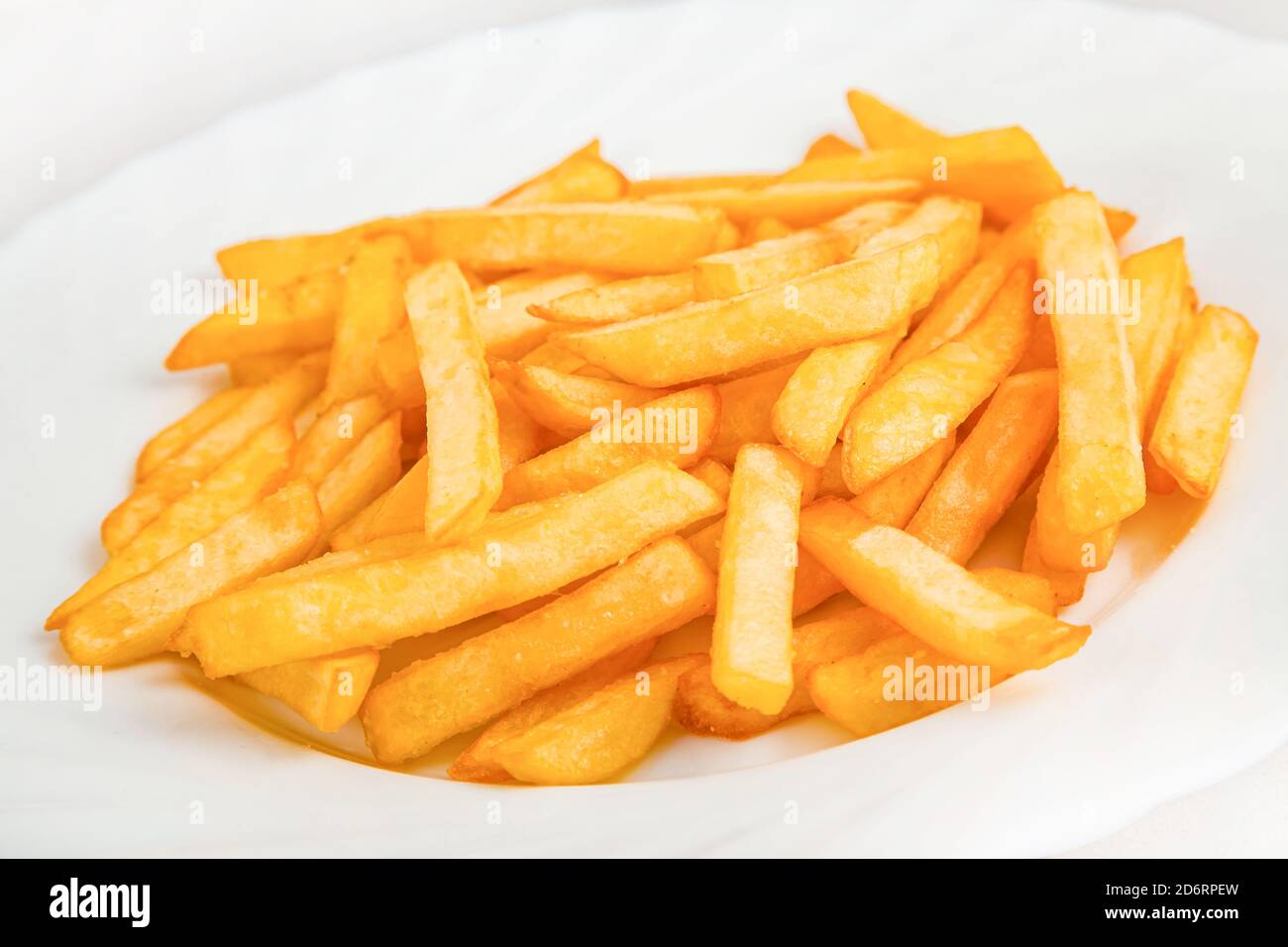 French fries on a plate, isolated on white background Stock Photo - Alamy