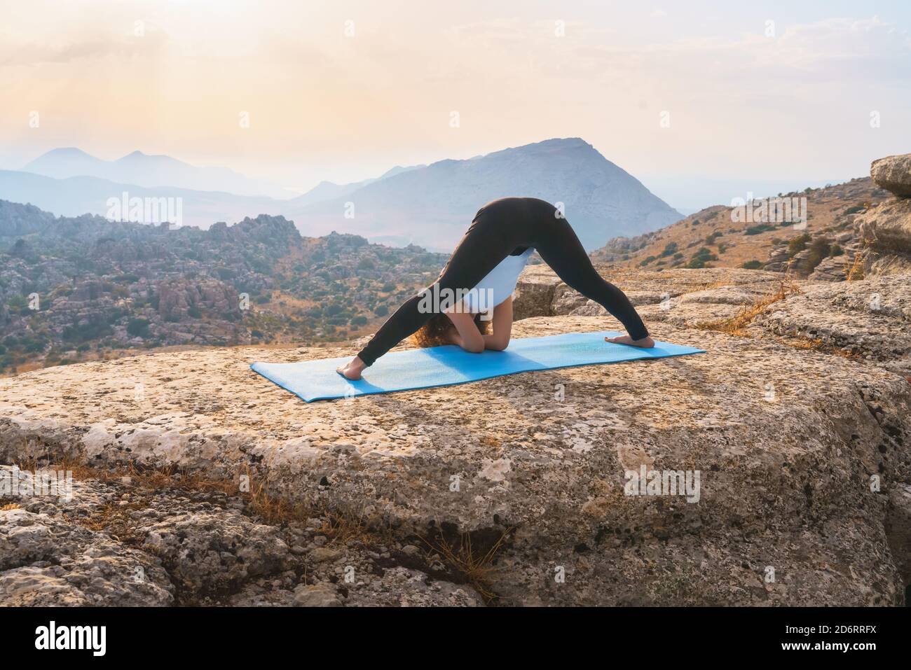 Full body back view of unrecognizable slim female doing variation of ...