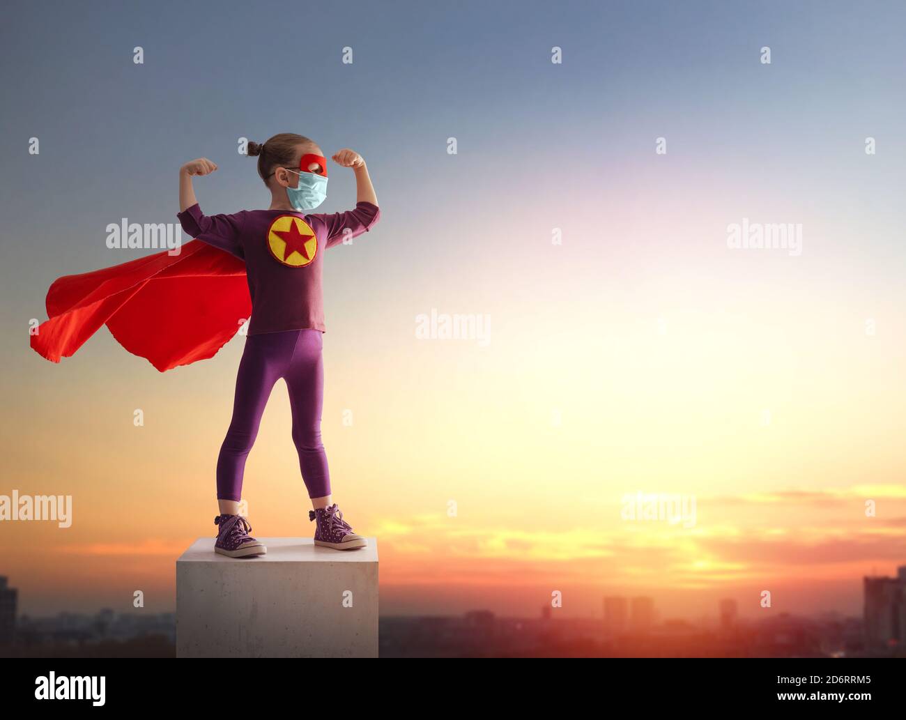 Little child playing superhero and wearing face mask during coronavirus ...