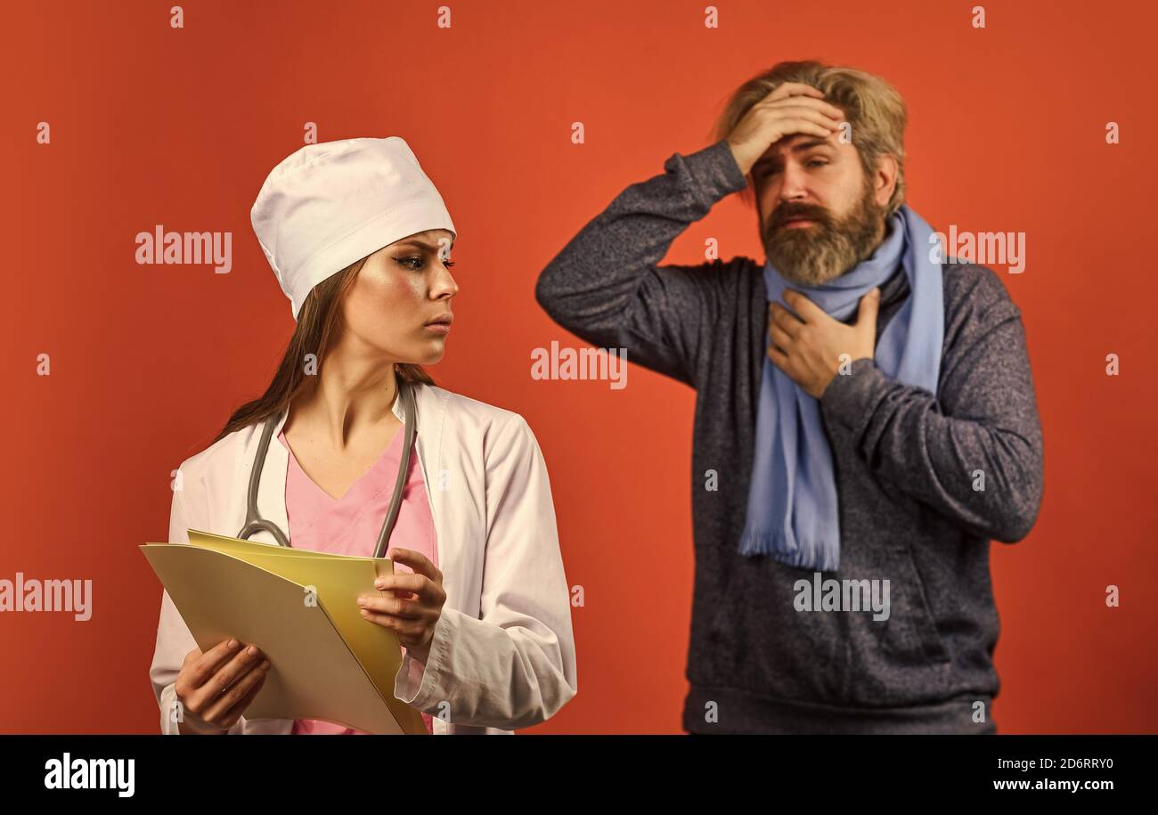 Nurse visiting unhealthy man at home. Cold flu symptoms. Virus epidemic ...