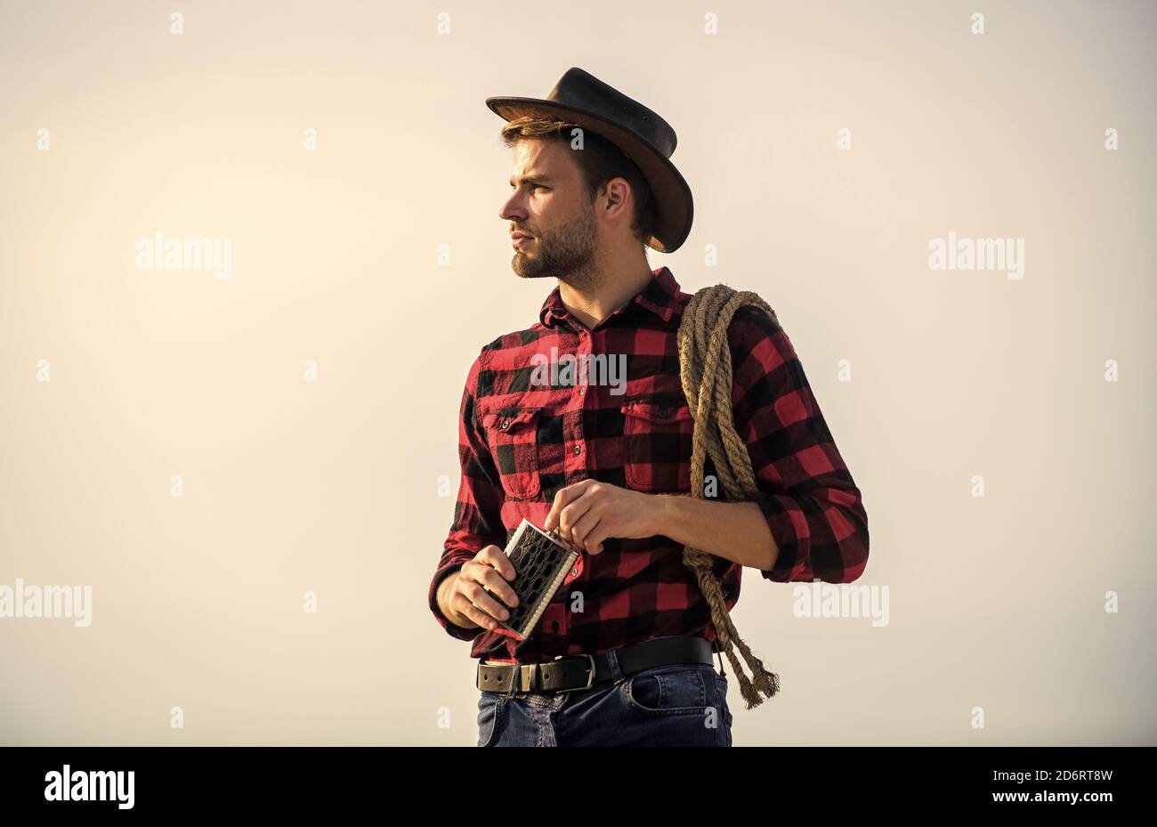 Looking for adventures. Farmer cowboy handsome man relaxing after hard ...