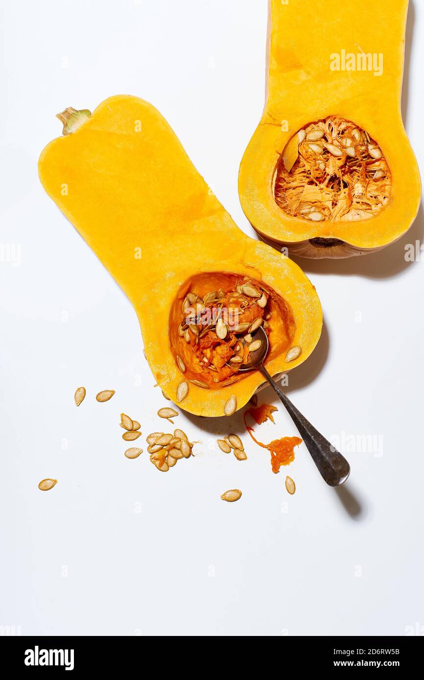 Deseeding a butternut squash with a spoon Stock Photo - Alamy