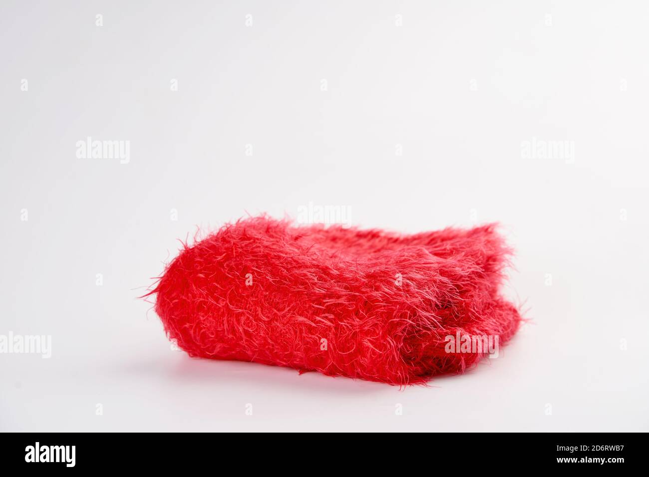Red fluffy plush cloth isolated on white background Stock Photo - Alamy