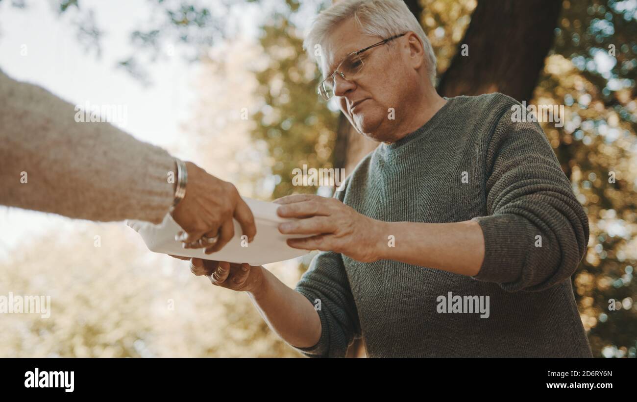 Homeless person receiving help hi-res stock photography and images - Alamy