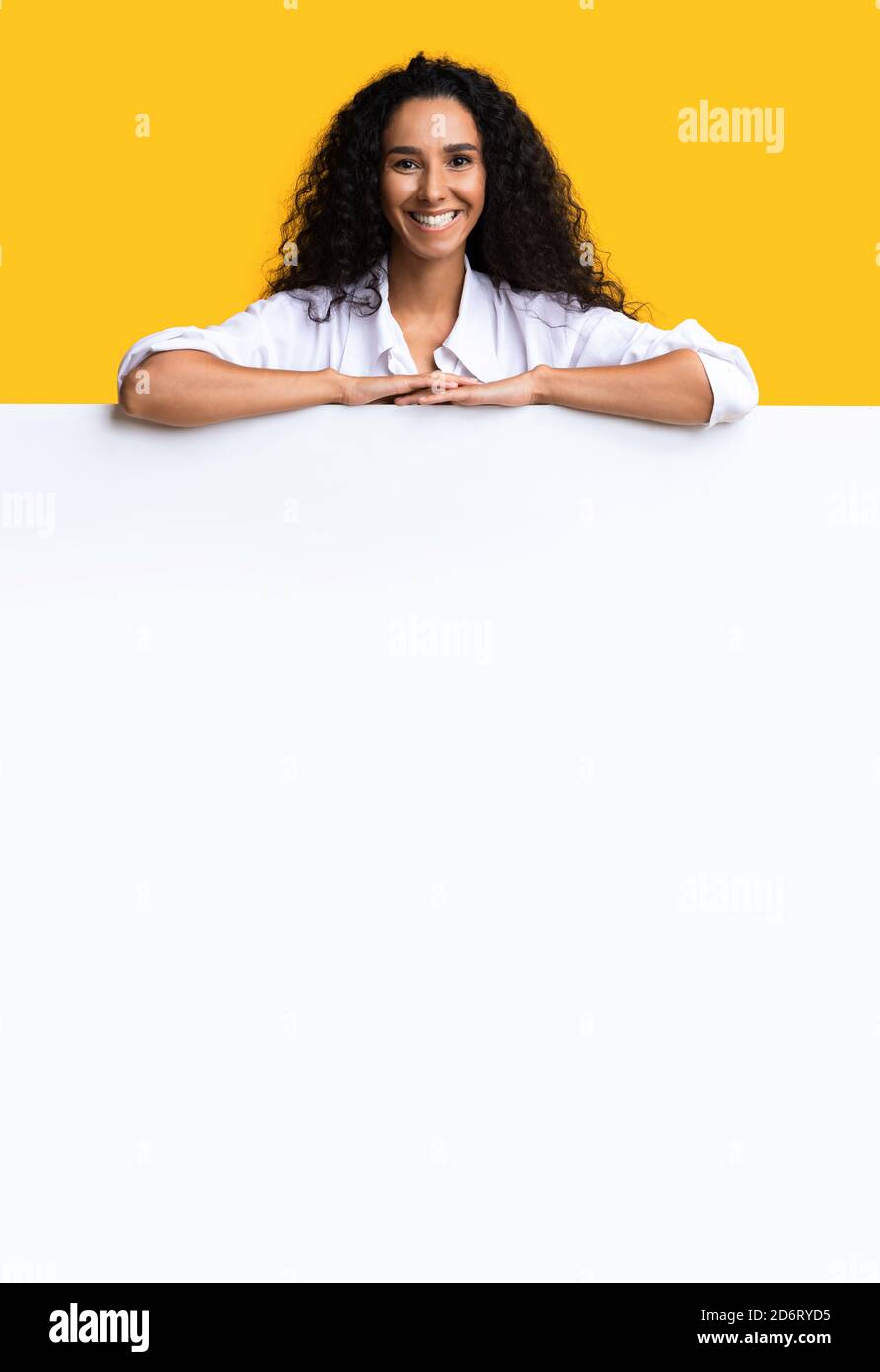 Free Place For Ad. Positive Lady Leaning On Blank White Advertisement ...