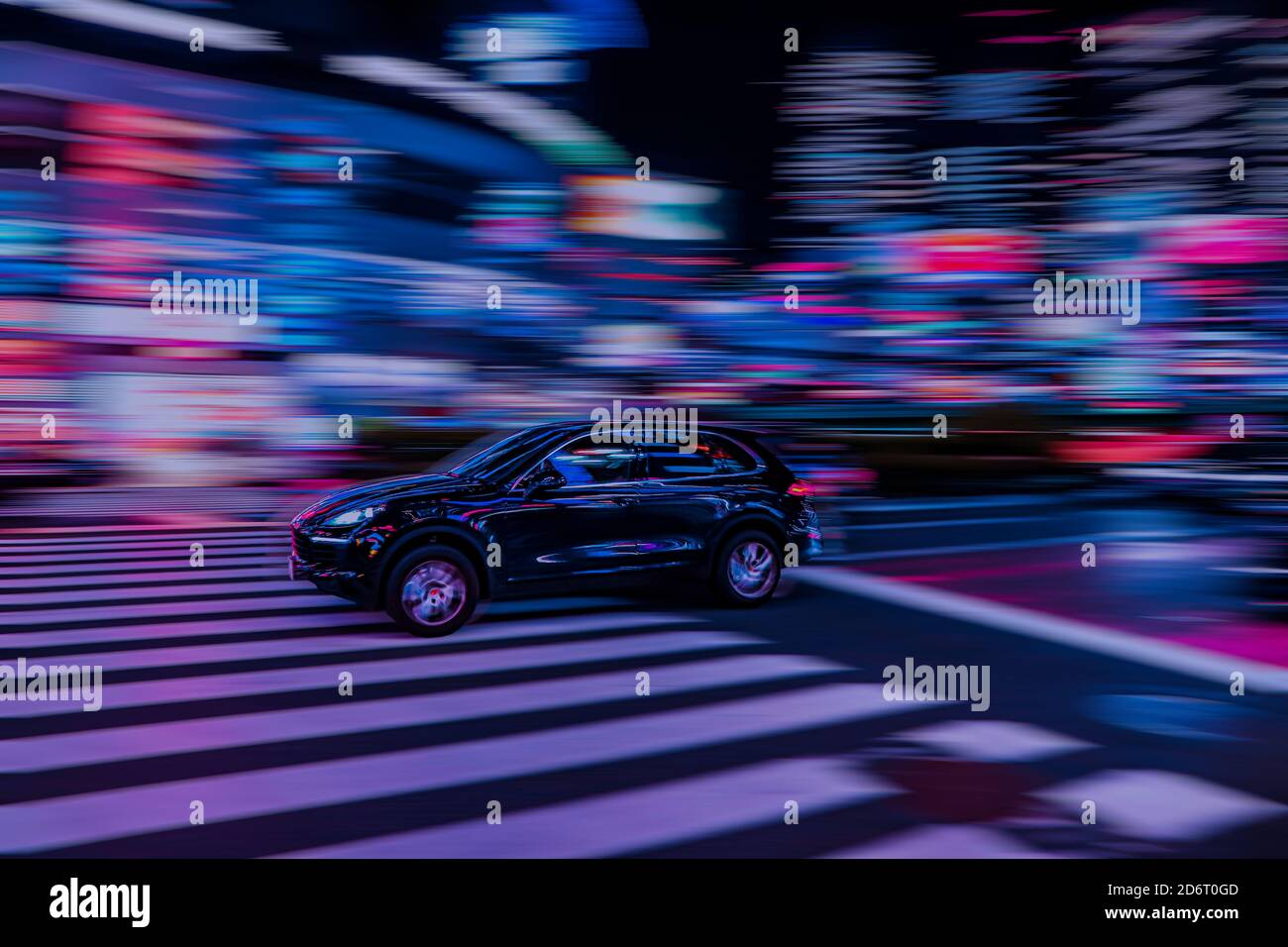 TOKYO, JAPAN - Jan 10, 2020: A passing car is photographed with the ...