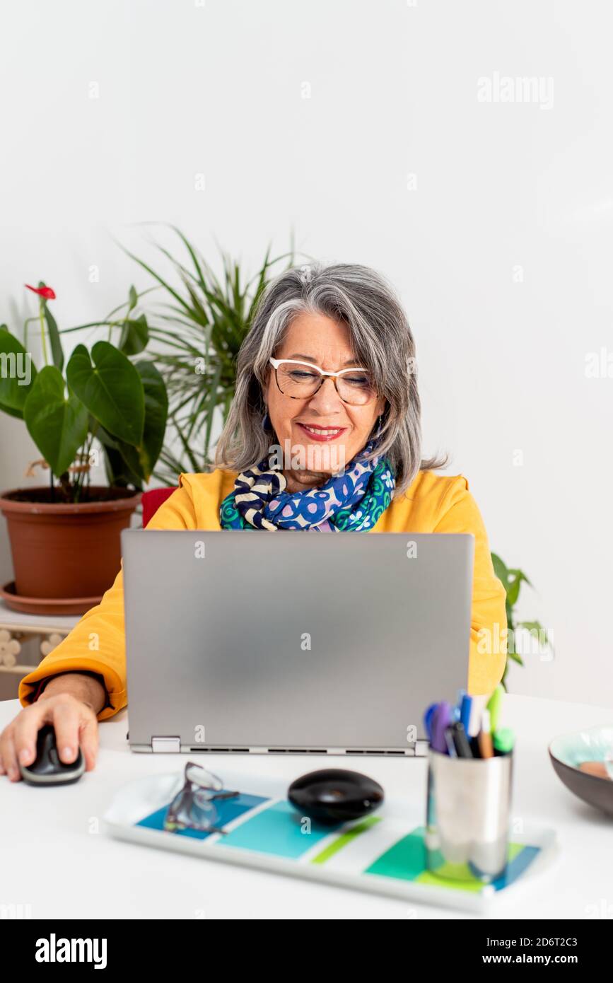 Content respectable mature businessWoman wearing trendy elegant clothes ...