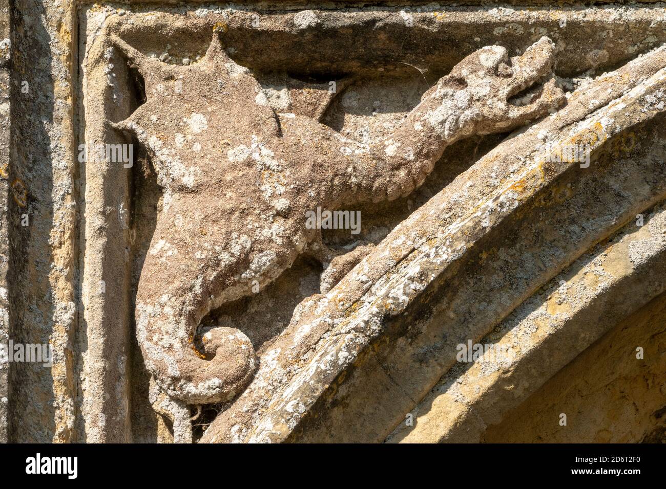 Dragon over porch of church at Sweffling, Suffolk Stock Photo - Alamy