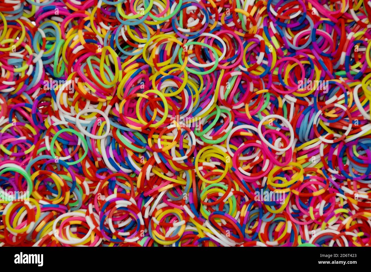 Lot of small and colored rubber bands for use as a background Stock ...