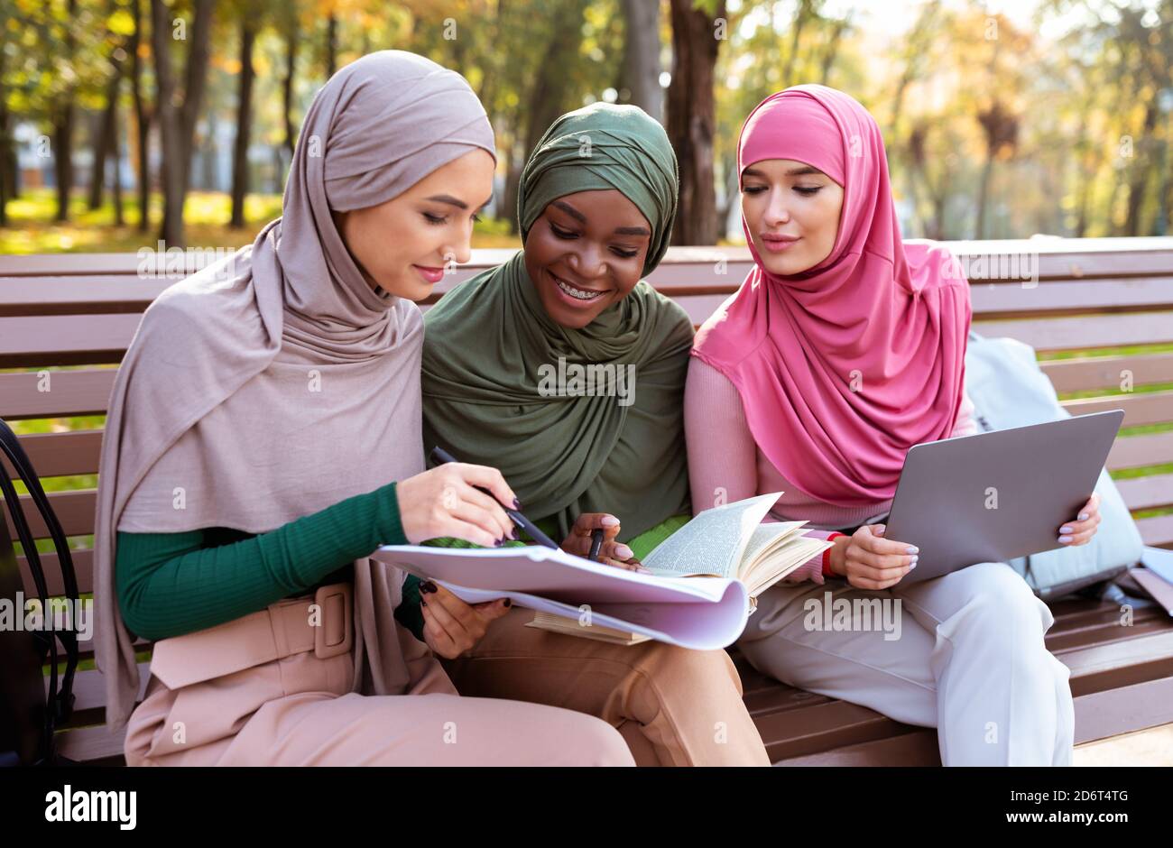 Three Muslim Students Women Learning Together Using Computer Sitting ...