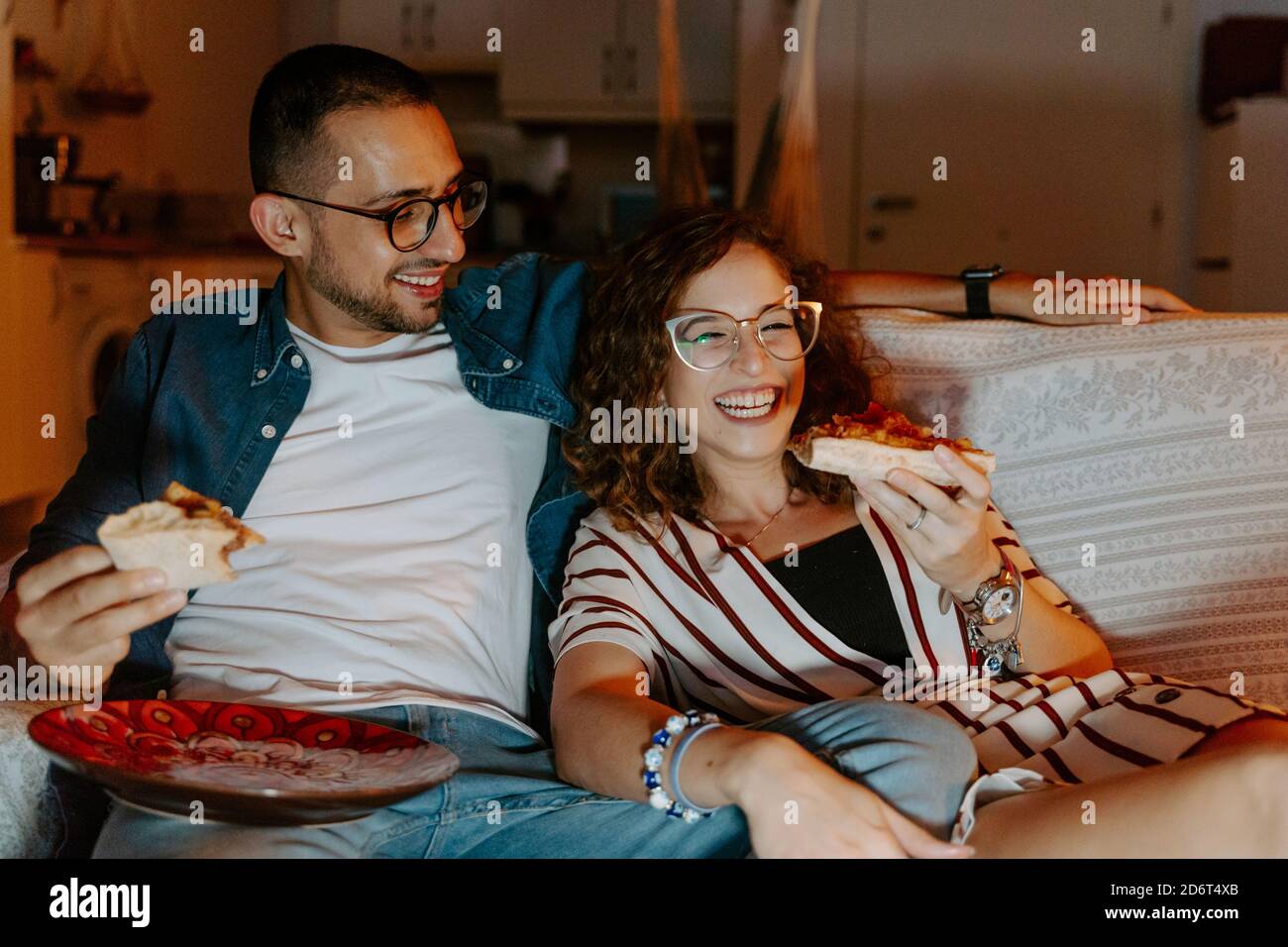 Couple watching movie cuddle hi-res stock photography and images - Alamy