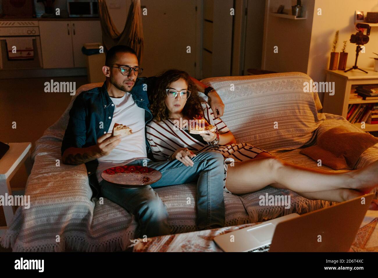 Couple watching movie cuddle hi-res stock photography and images - Alamy