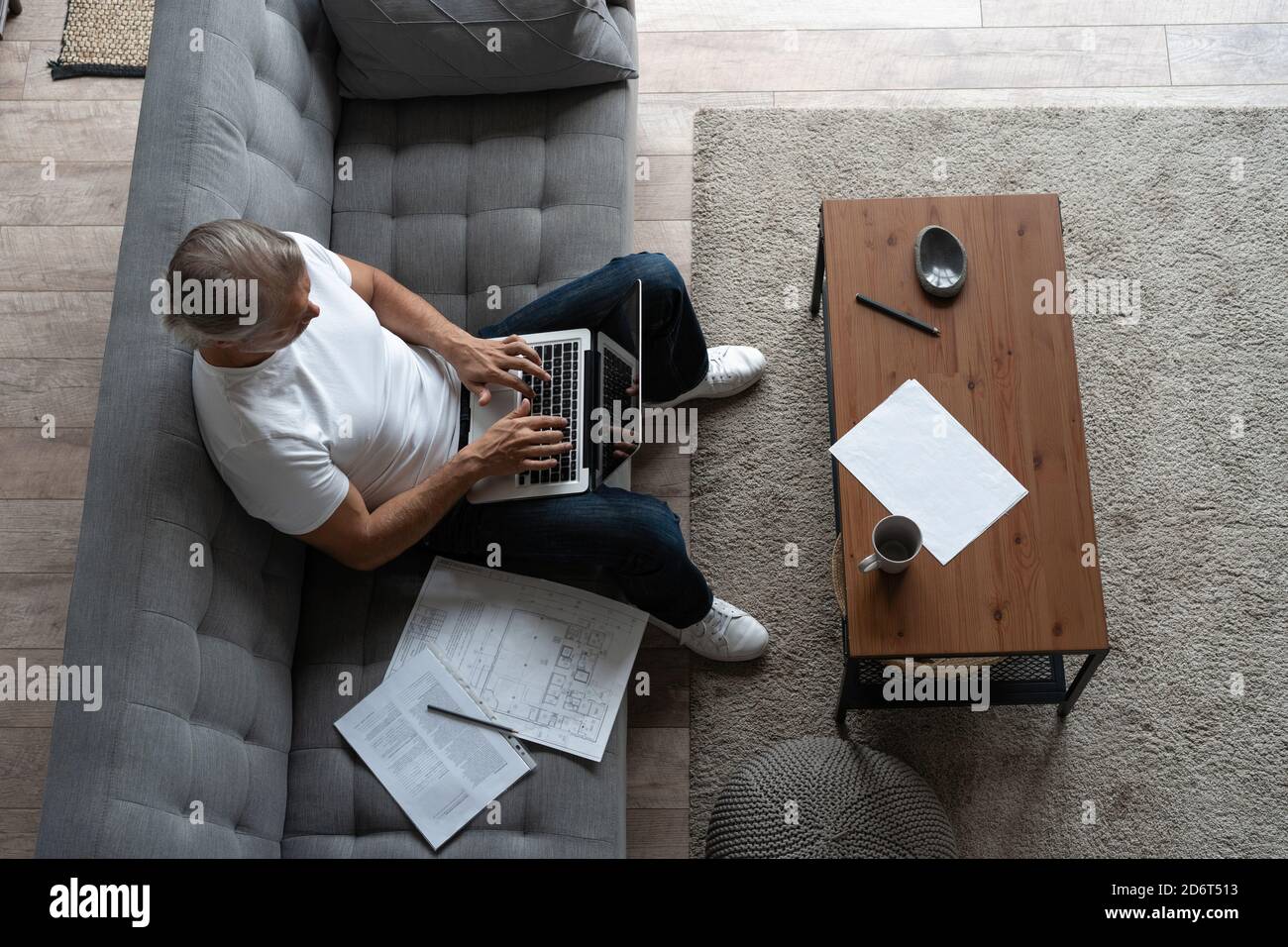 Middle-aged man working from home-office on laptop Stock Photo - Alamy