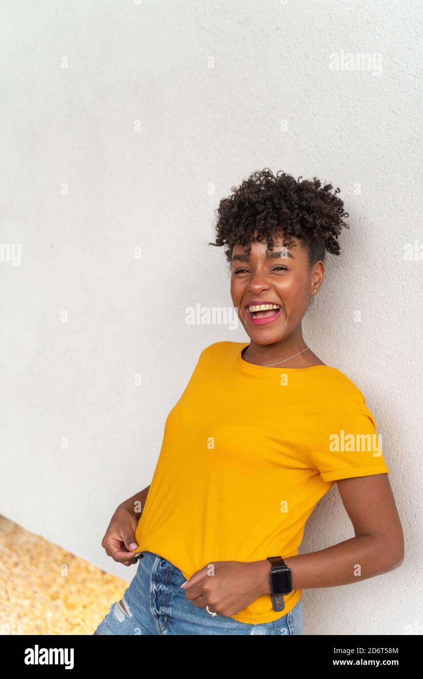 Back view of unrecognizable dark haired female standing on top of rocky ...