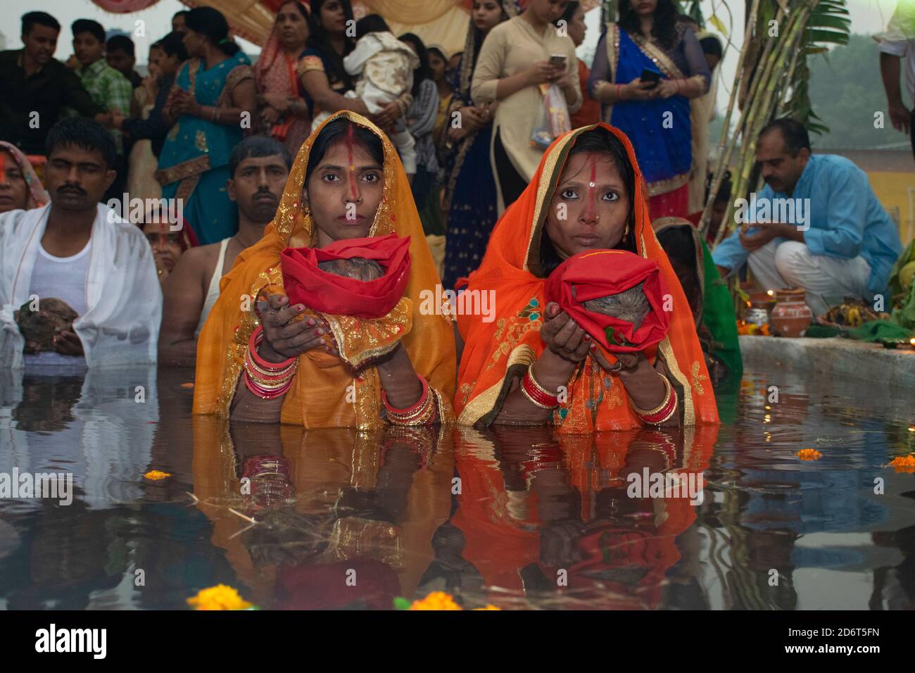 Indian women performing chhath pooja.Chhath is an ancient Hindu Vedic ...