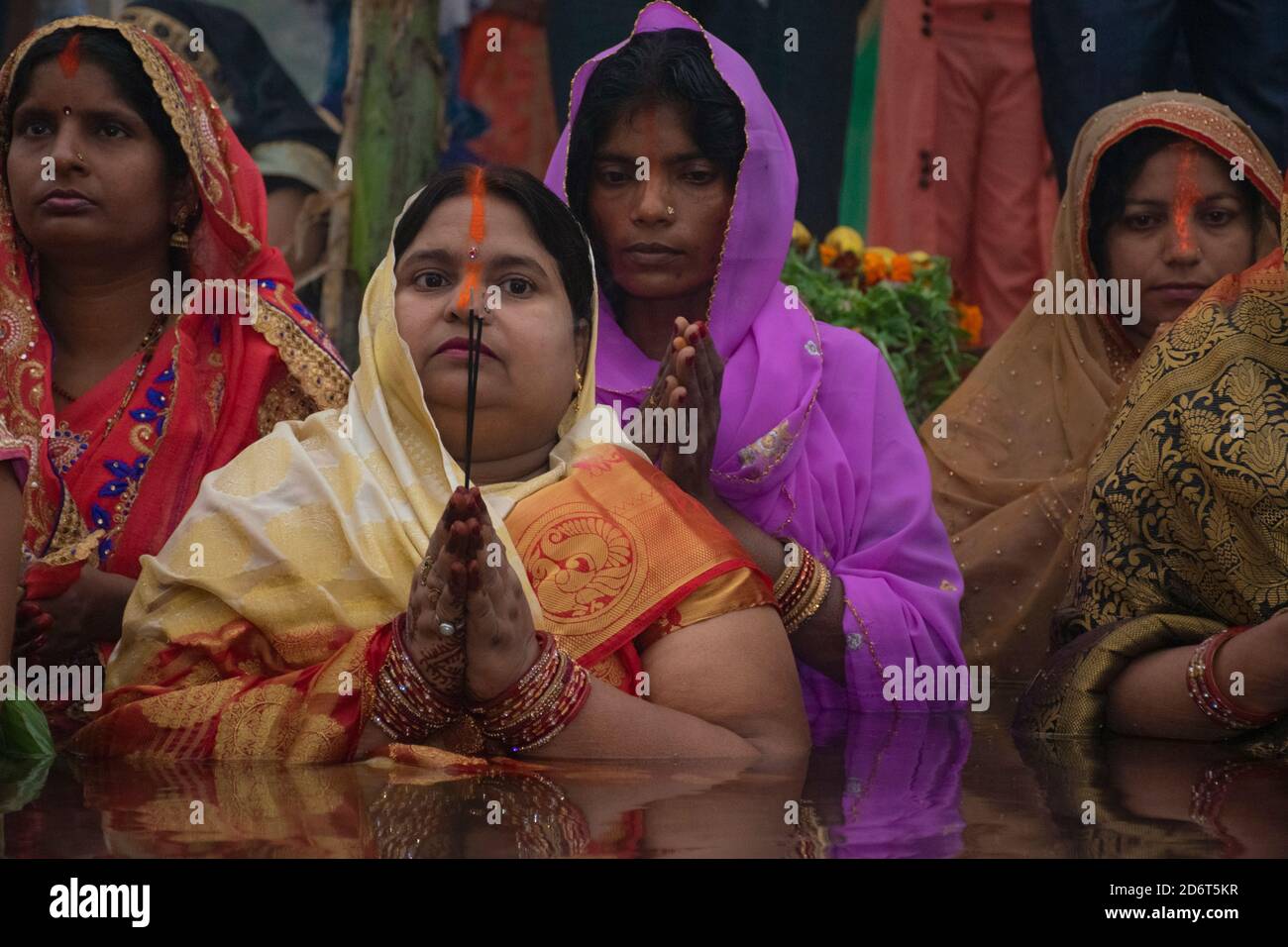 Indian women performing chhath pooja.Chhath is an ancient Hindu Vedic ...