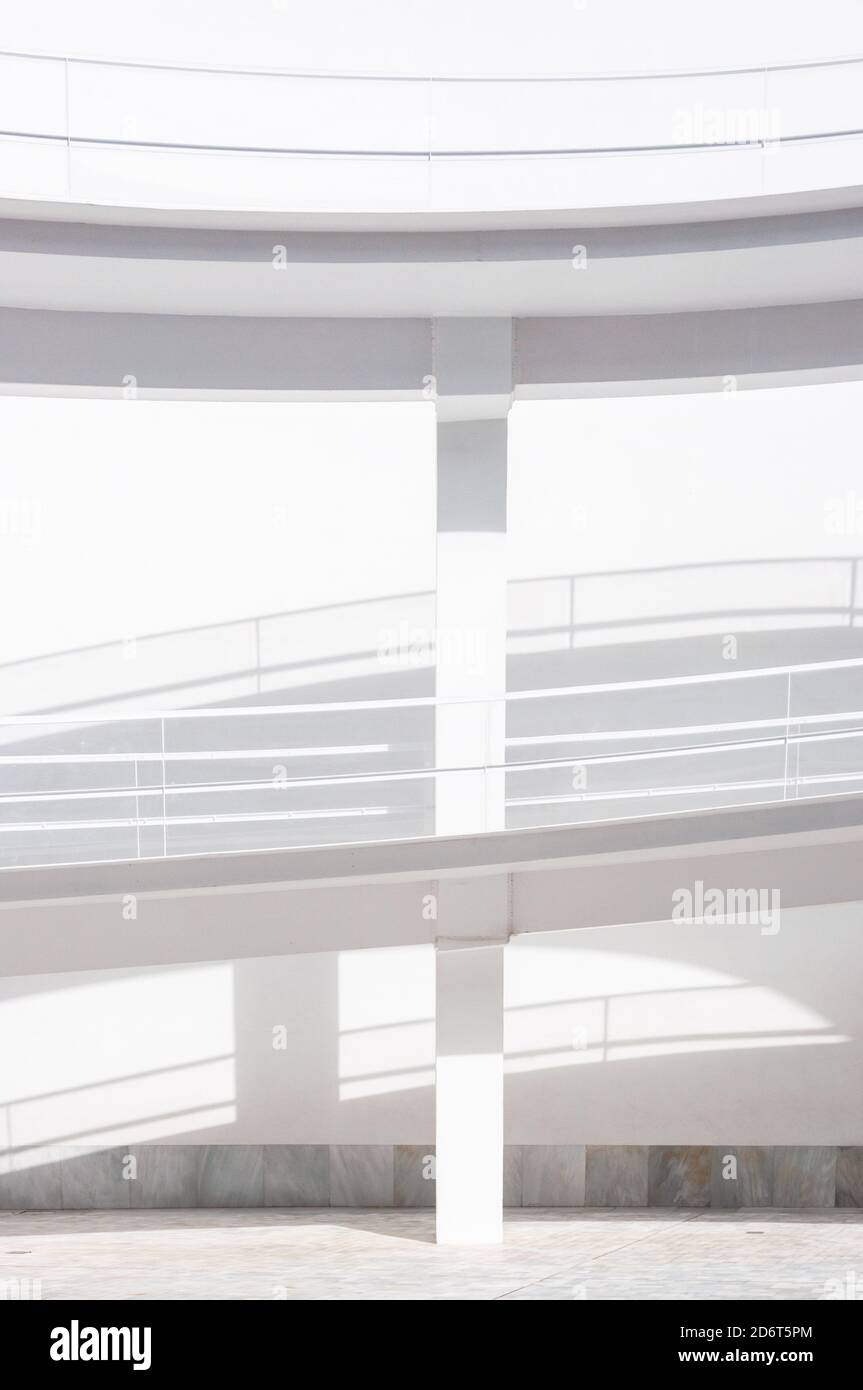 White smooth ramps or inclines with railings located outside modern ...