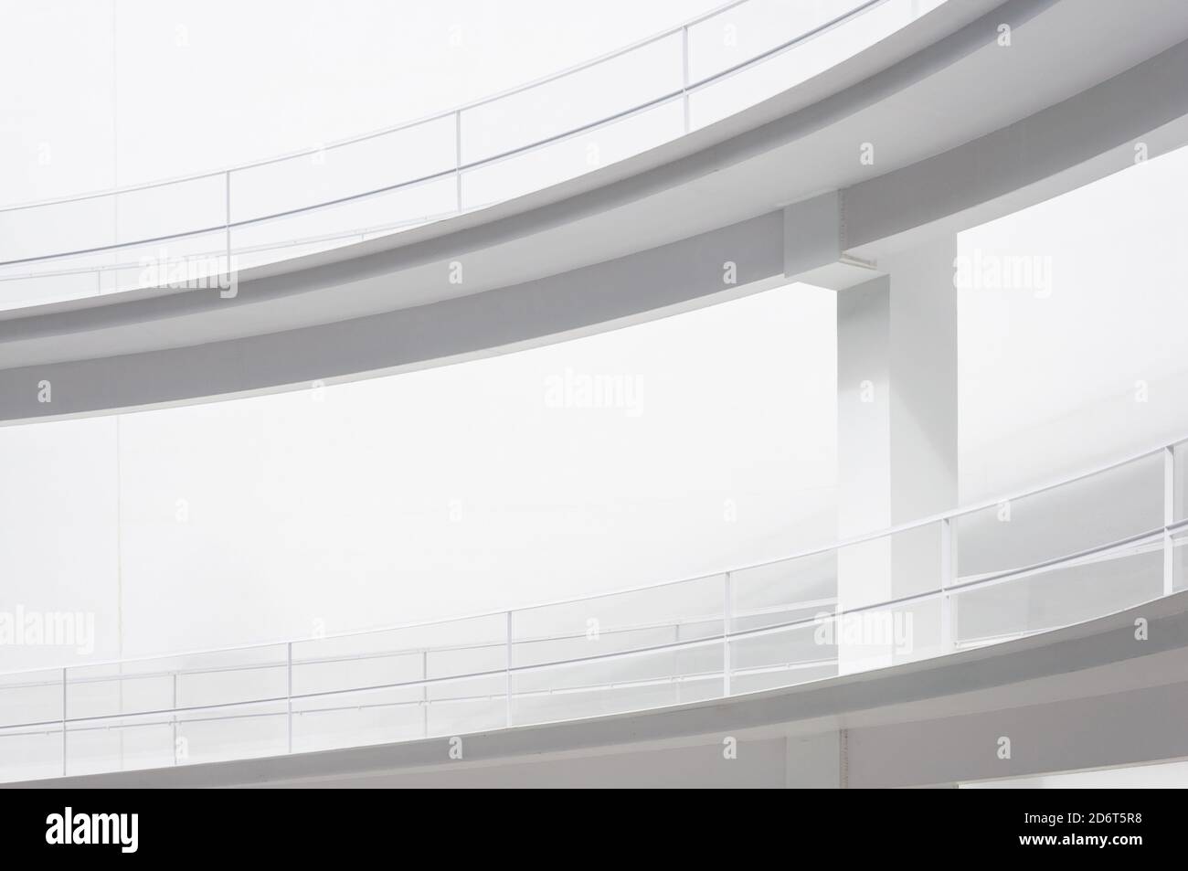 White smooth ramps or inclines with railings located outside modern ...