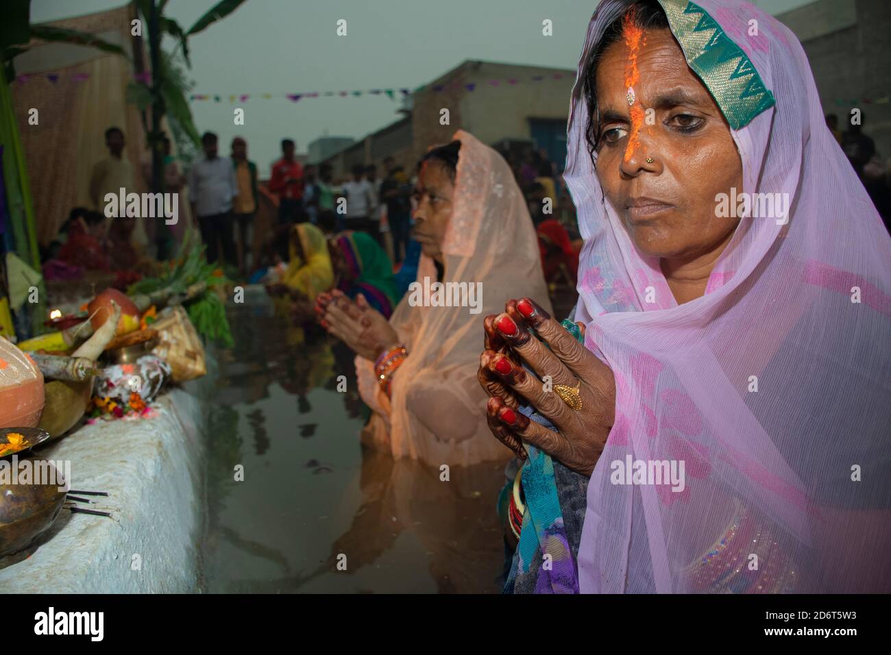 Indian women performing chhath pooja.Chhath is an ancient Hindu Vedic ...