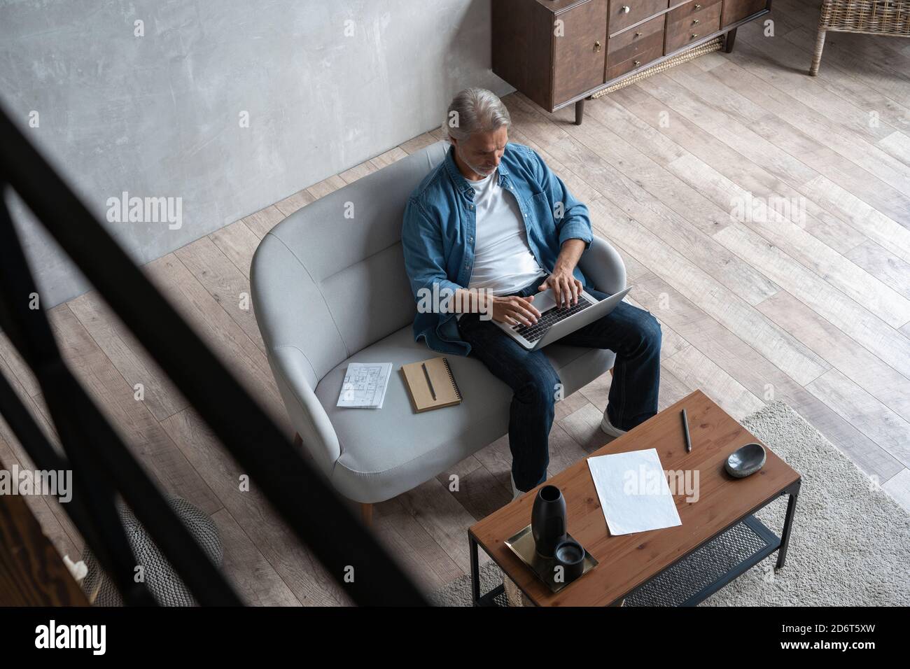 Middle-aged man working from home-office on laptop Stock Photo - Alamy