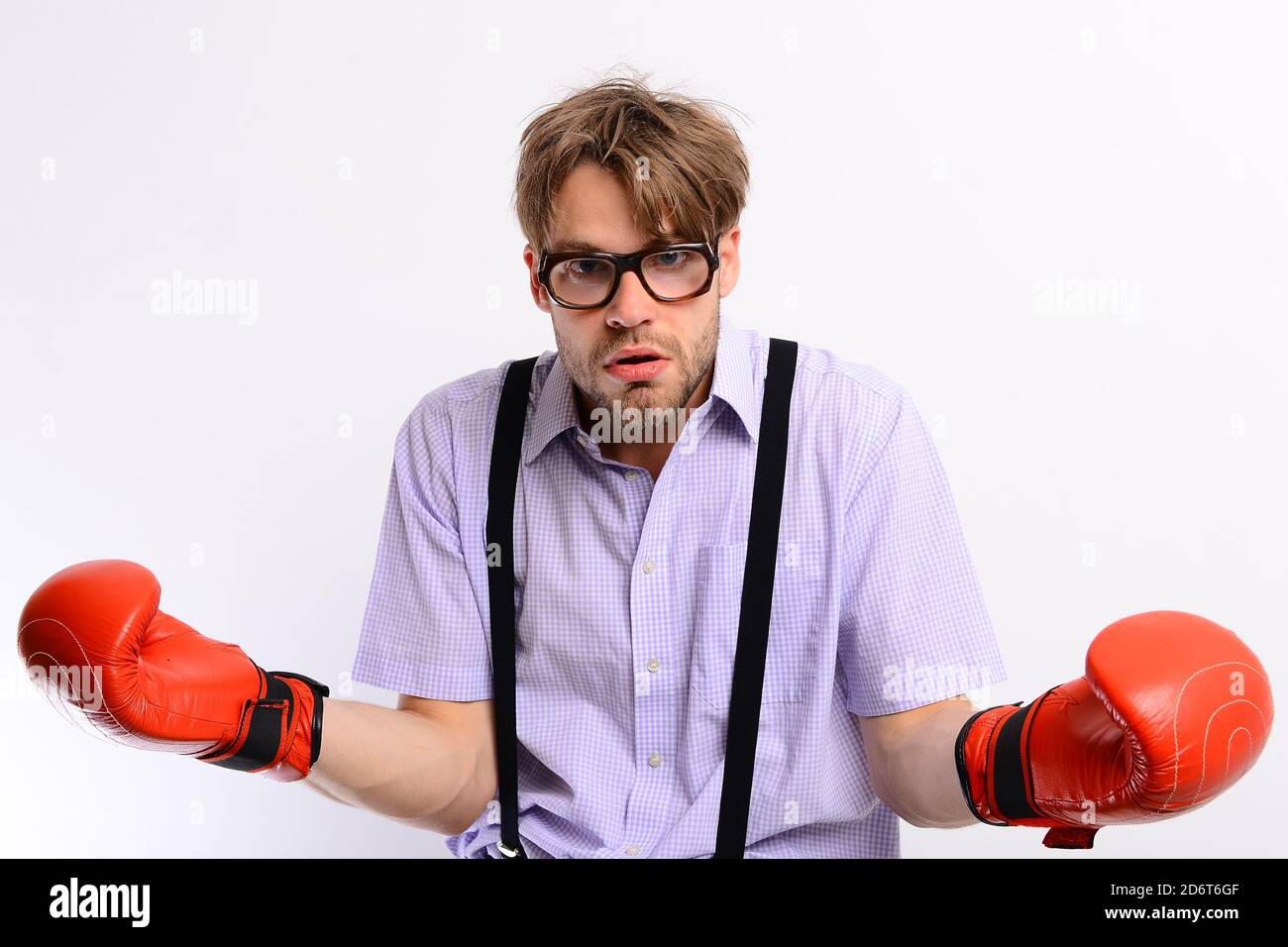 Weak guy makes hits and punches. Man with bristle and troubled face ...