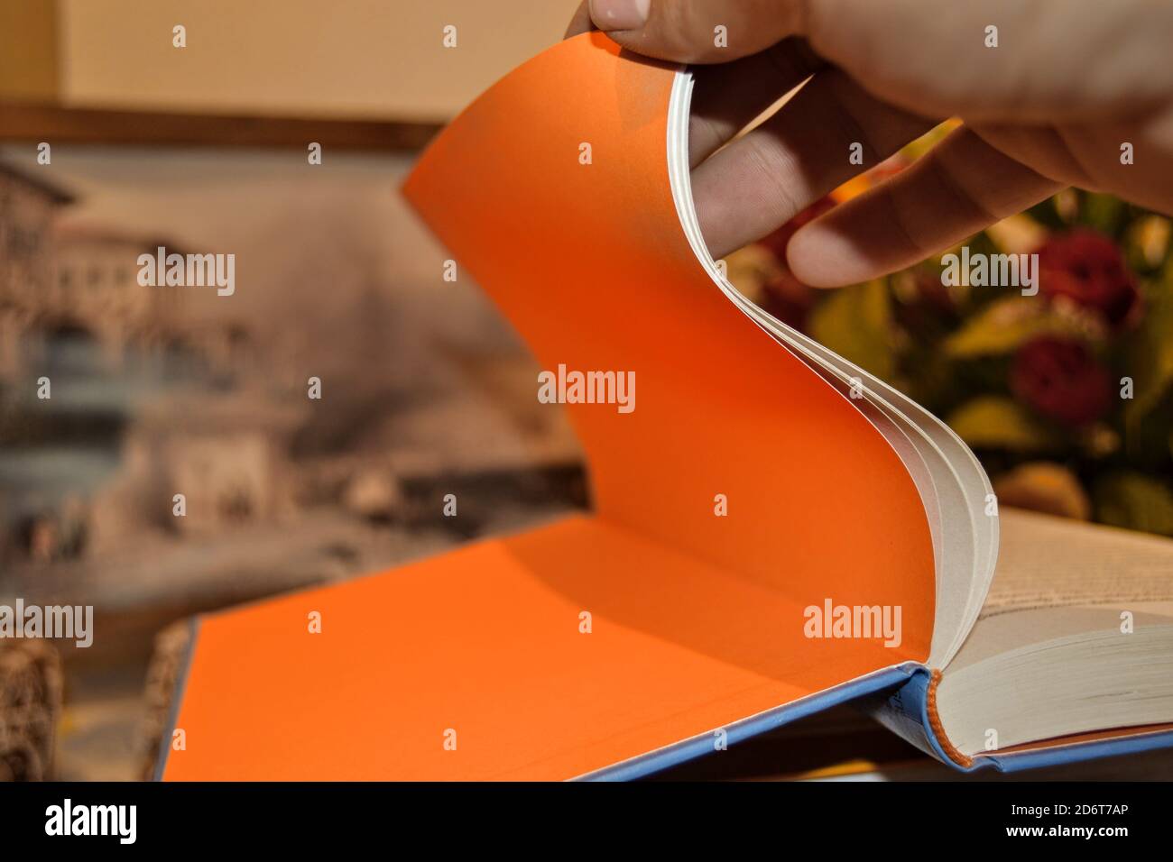 Opening of a book and hand Stock Photo - Alamy