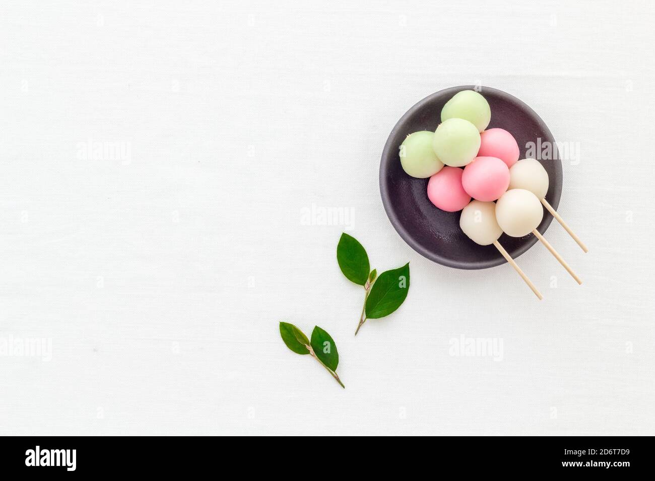 Japanese Dango dessert in pink, white and green colors, copy space ...