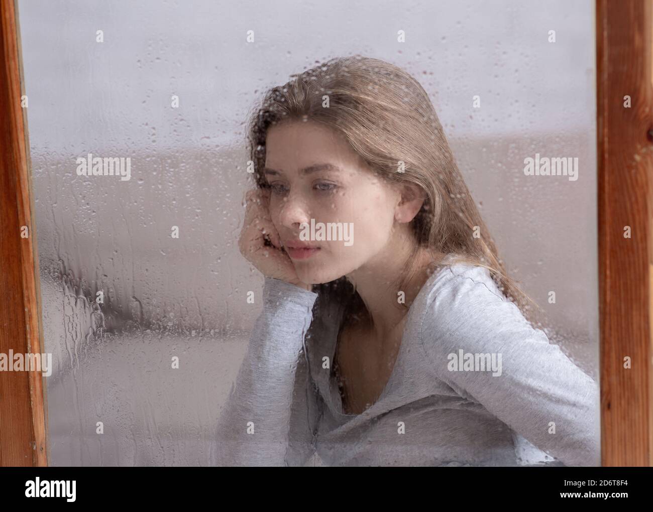 A Sad Girl Thinking In Rain