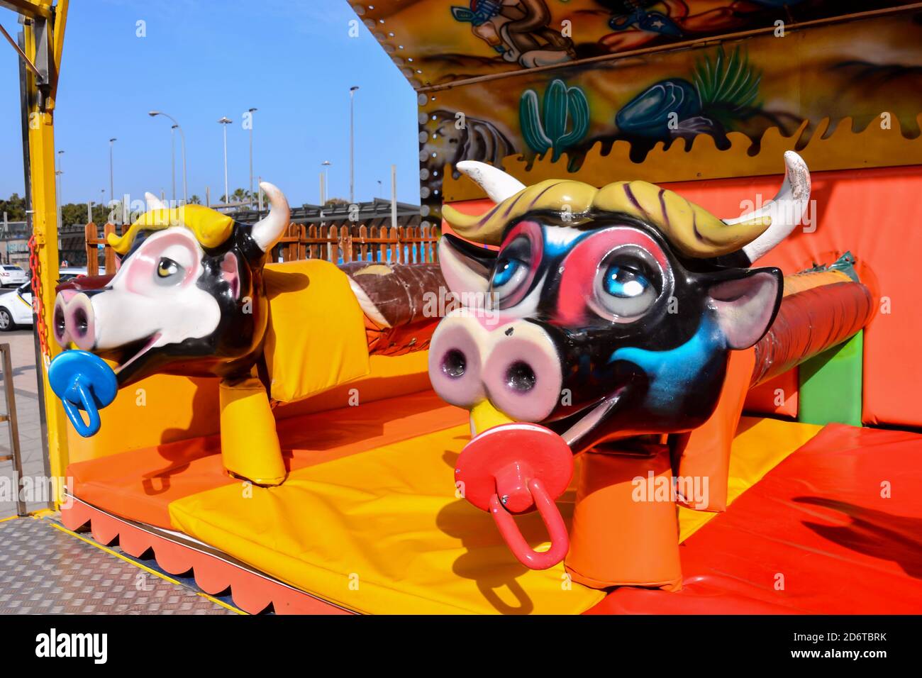 Outdoor vintage flying cow carousel Stock Photo - Alamy