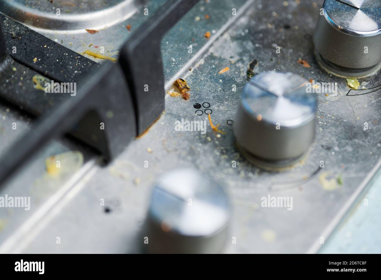 Dirty gas stove top with food leftovers. Unclean steel kitchen cooktop ...