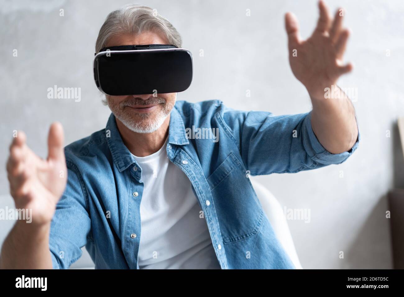Handsome man trying vr glasses at home Stock Photo - Alamy Handsome man trying vr glasses at home Stock Photo - Alamy