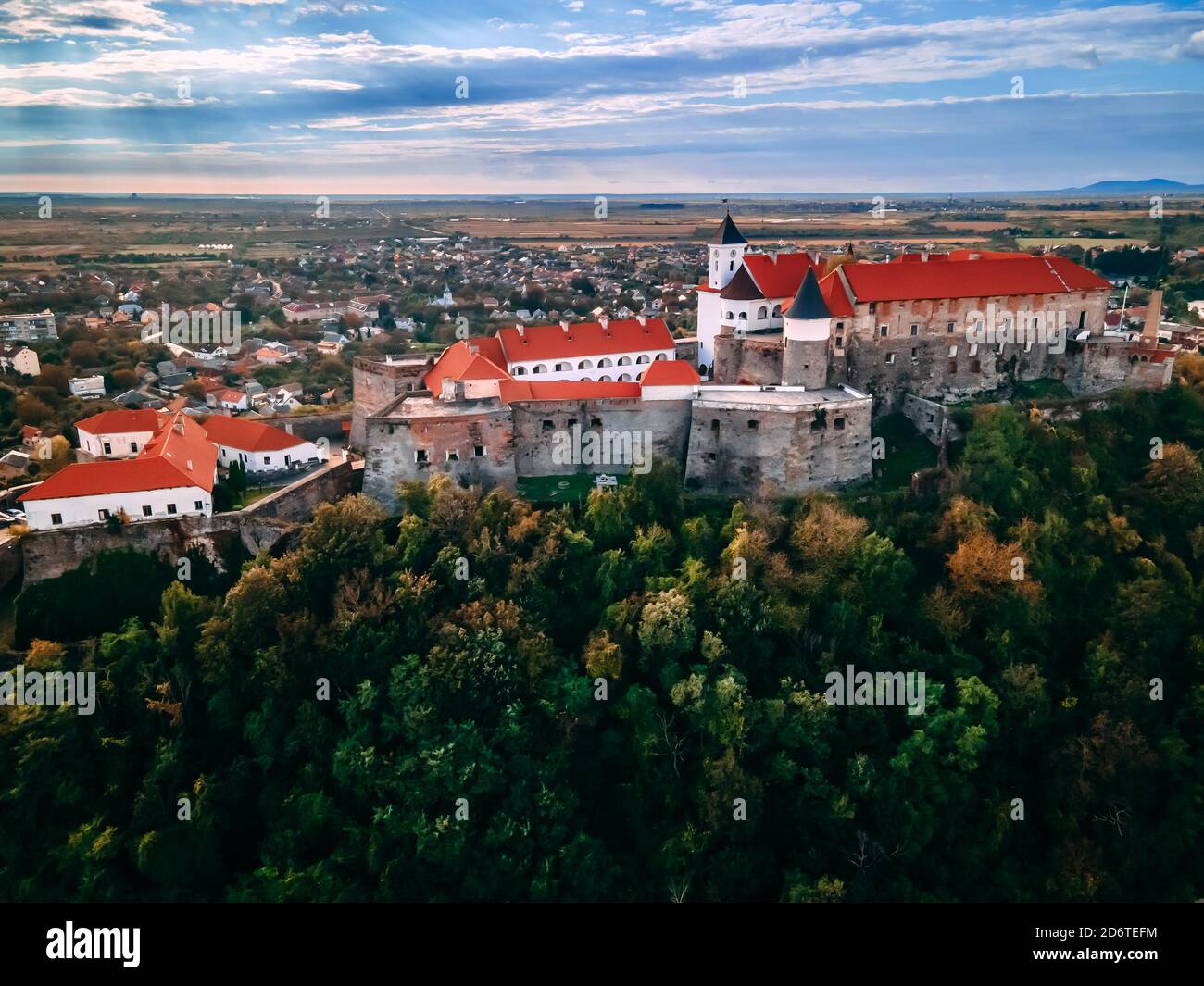 Aerial view of medieval castle on mountain in small european city in ...
