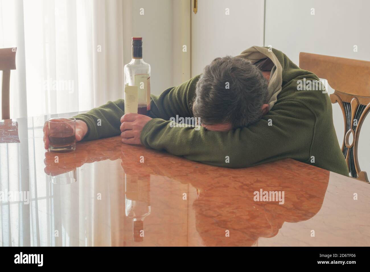 Adult person affected by alcohol addiction Stock Photo - Alamy